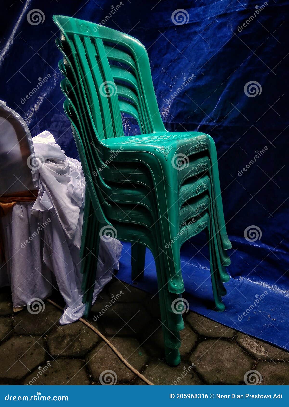 Stack of plastic chairs stock photo. Image of screenshot - 205968316