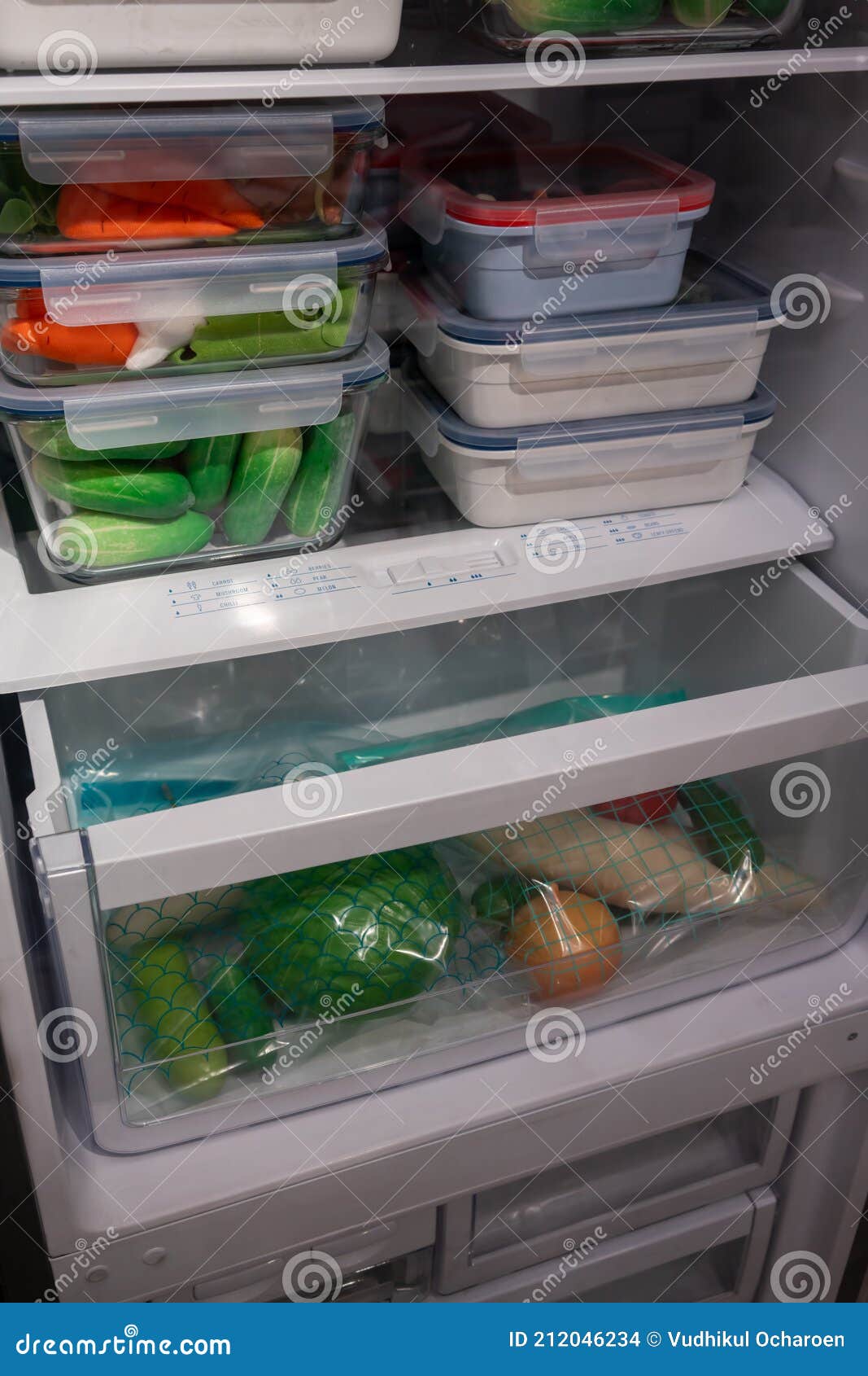 Stack of Plastic Containers in Refrigerator for Display Stock Photo ...