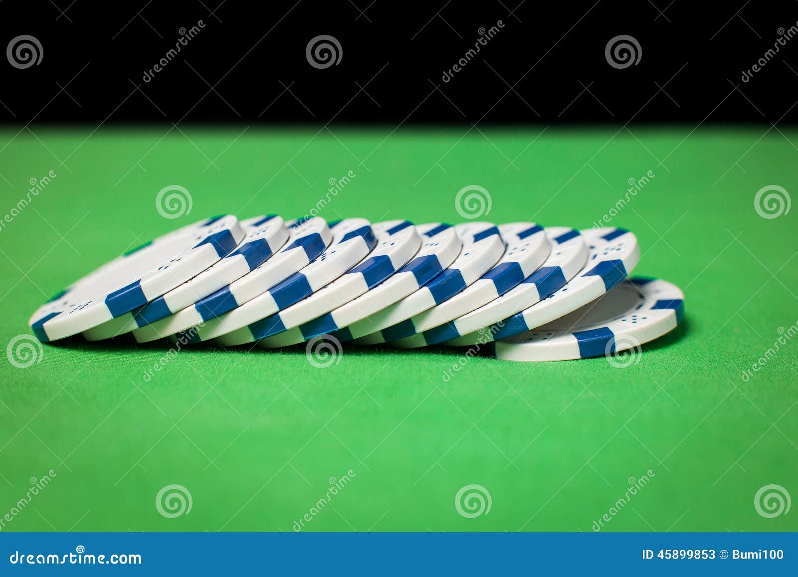 Stack of Poker Chips on a Green Table Stock Image - Image of ...