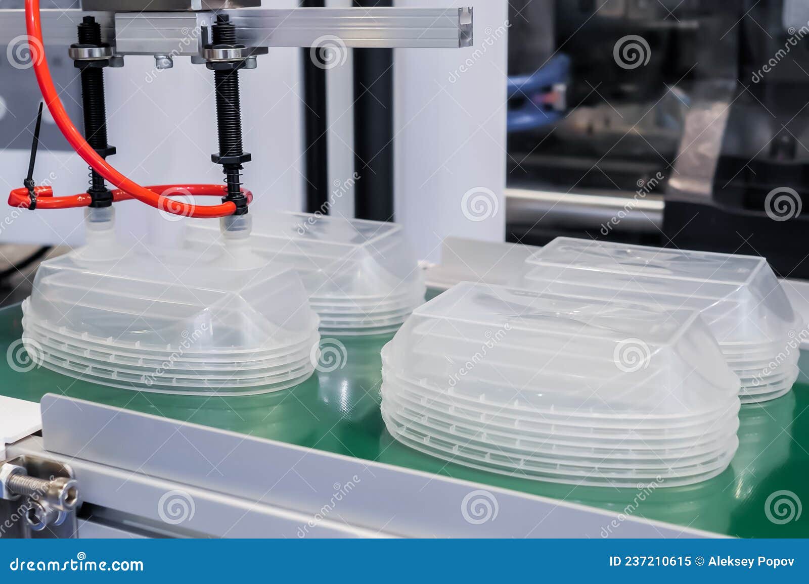 Empty Food Containers on Conveyor Belt of Plastic Injection Molding ...