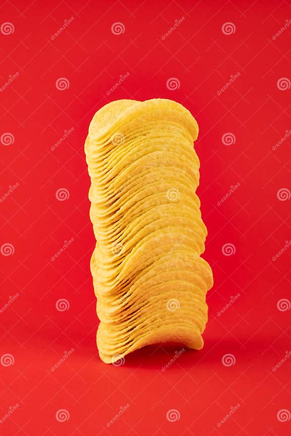 Stack of Potato Chips in Bright Red Background. Minimalistic Image of ...