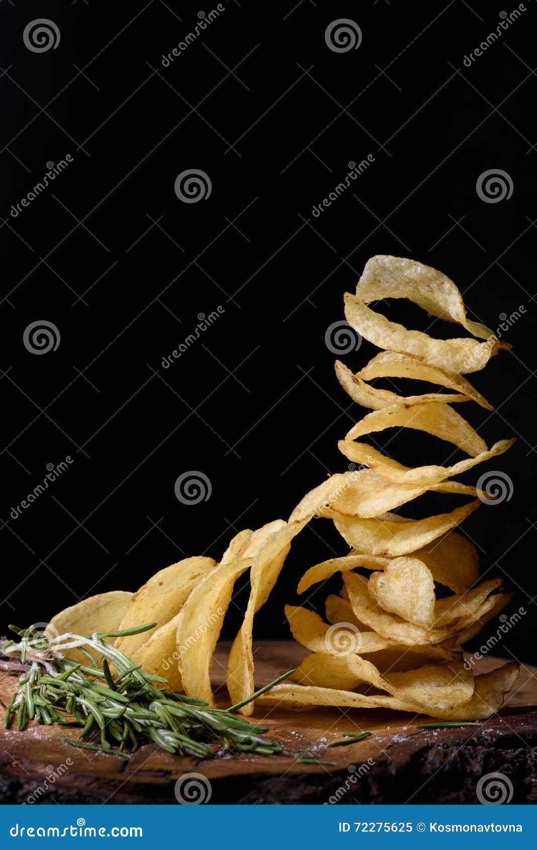 Stack of Potato Chips with Herbs, Tasty Snack on Wood, Closeup. Stock ...