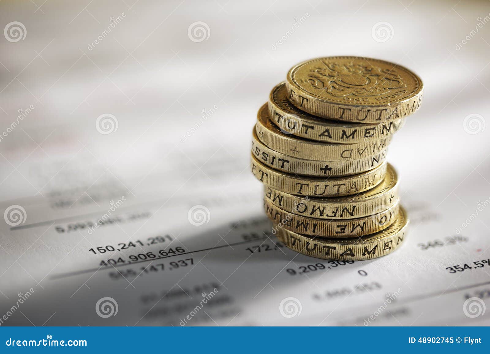 Stack of Pound Coins on Financial Figures Stock Image - Image of ...