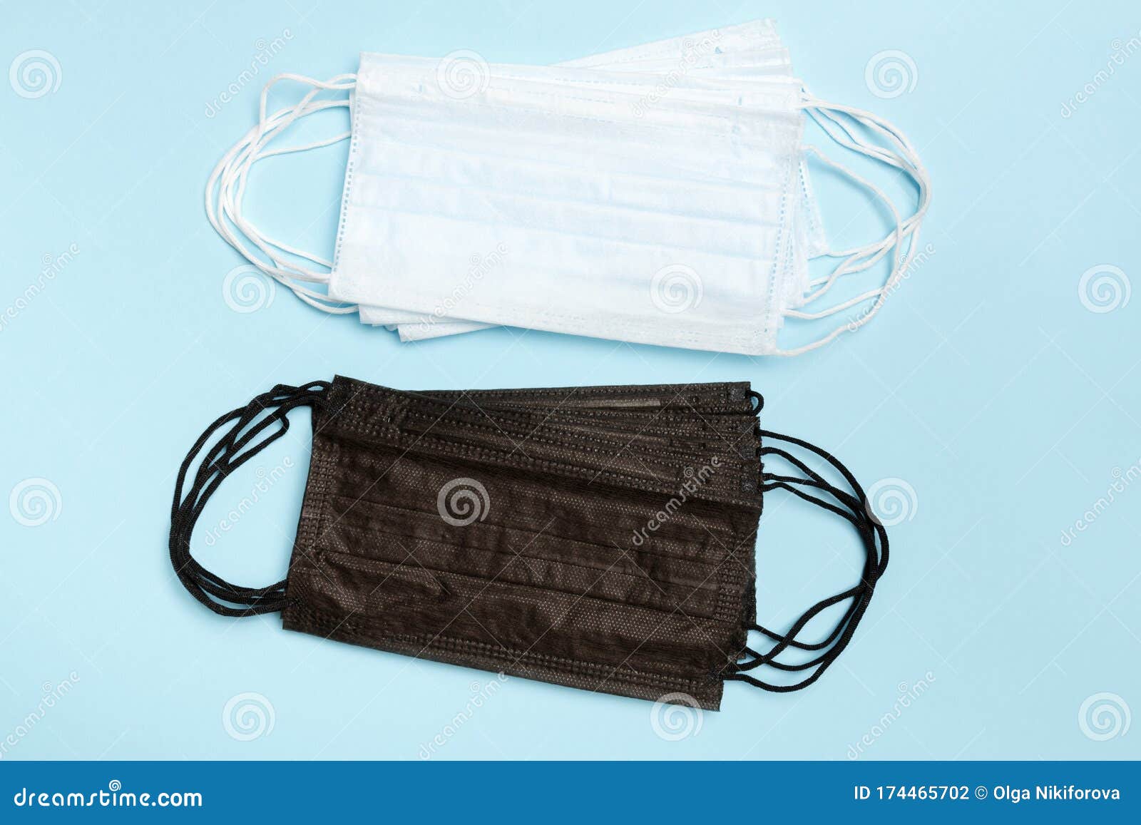 Stack of Protective Disposable Medical Masks of White and Black Colors ...