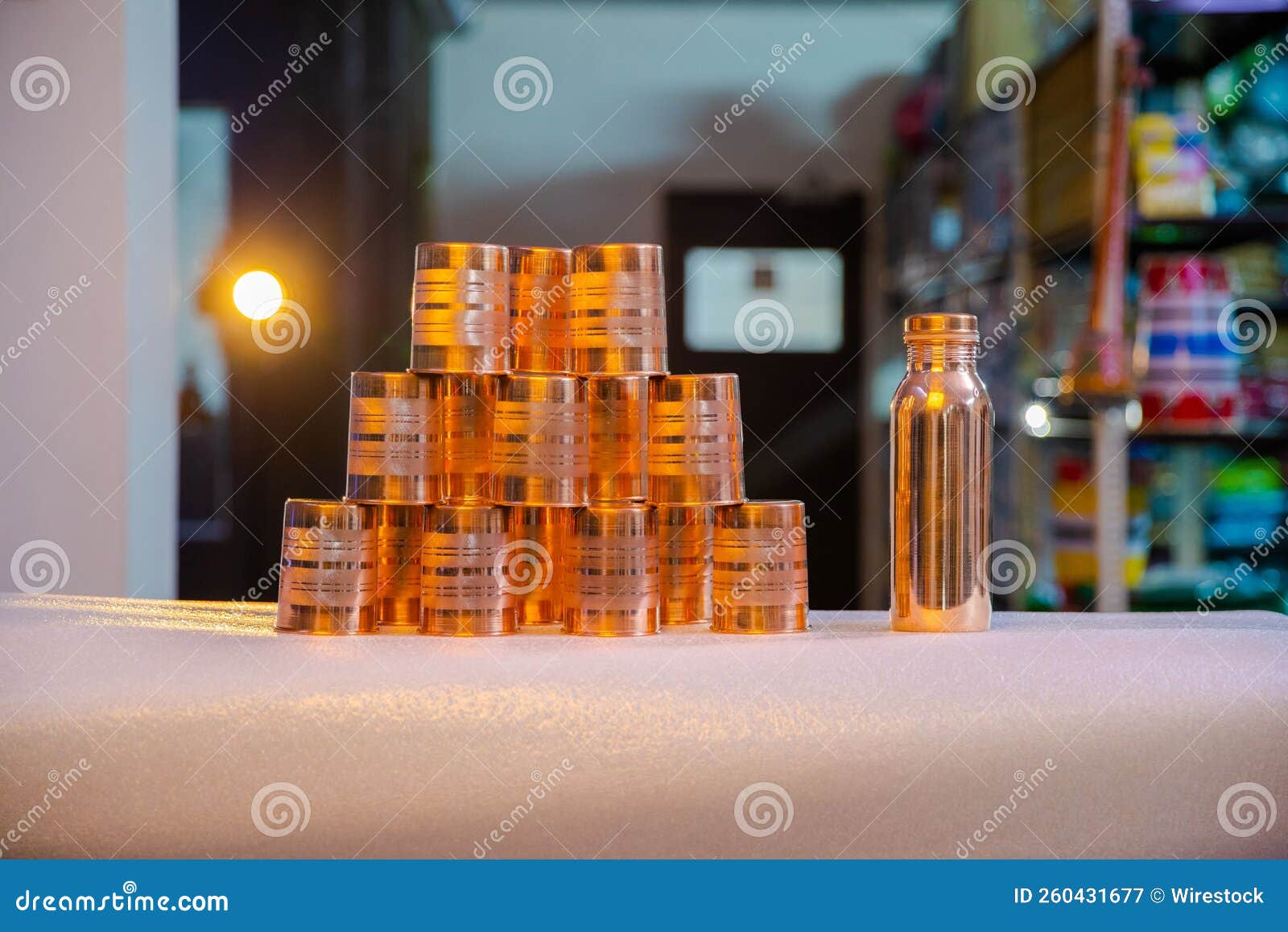 Stack of Pure Copper Containers with an Embossed Design Near a Copper ...