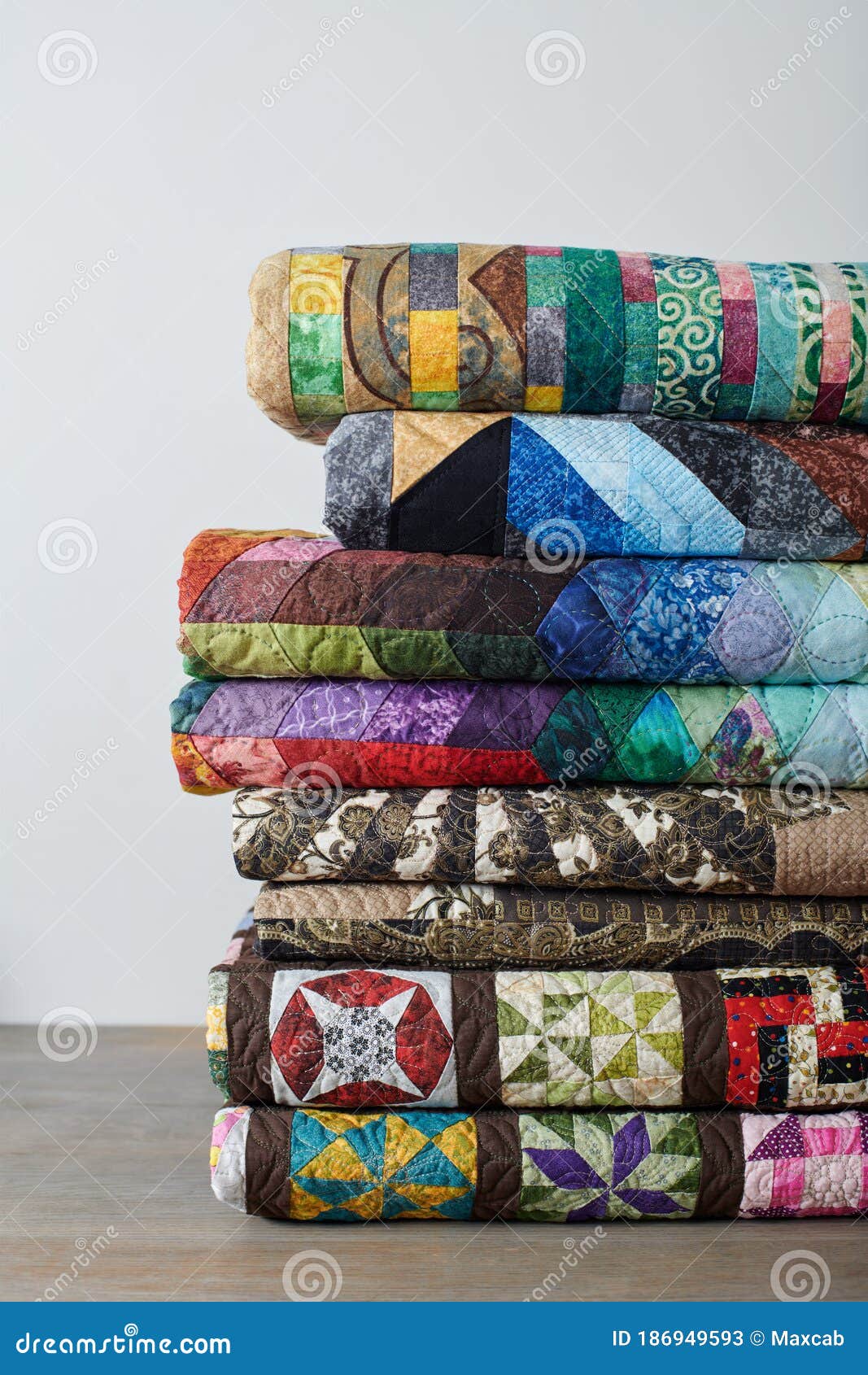 Stack of Quilts on White Wall Background Stock Image - Image of stack ...