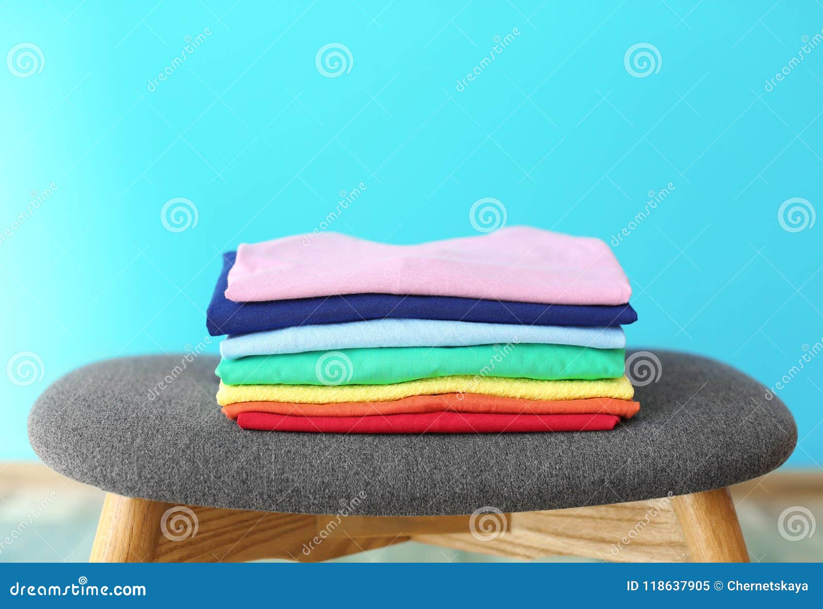 Stack of Rainbow Clothes on Stool Stock Image - Image of sale ...