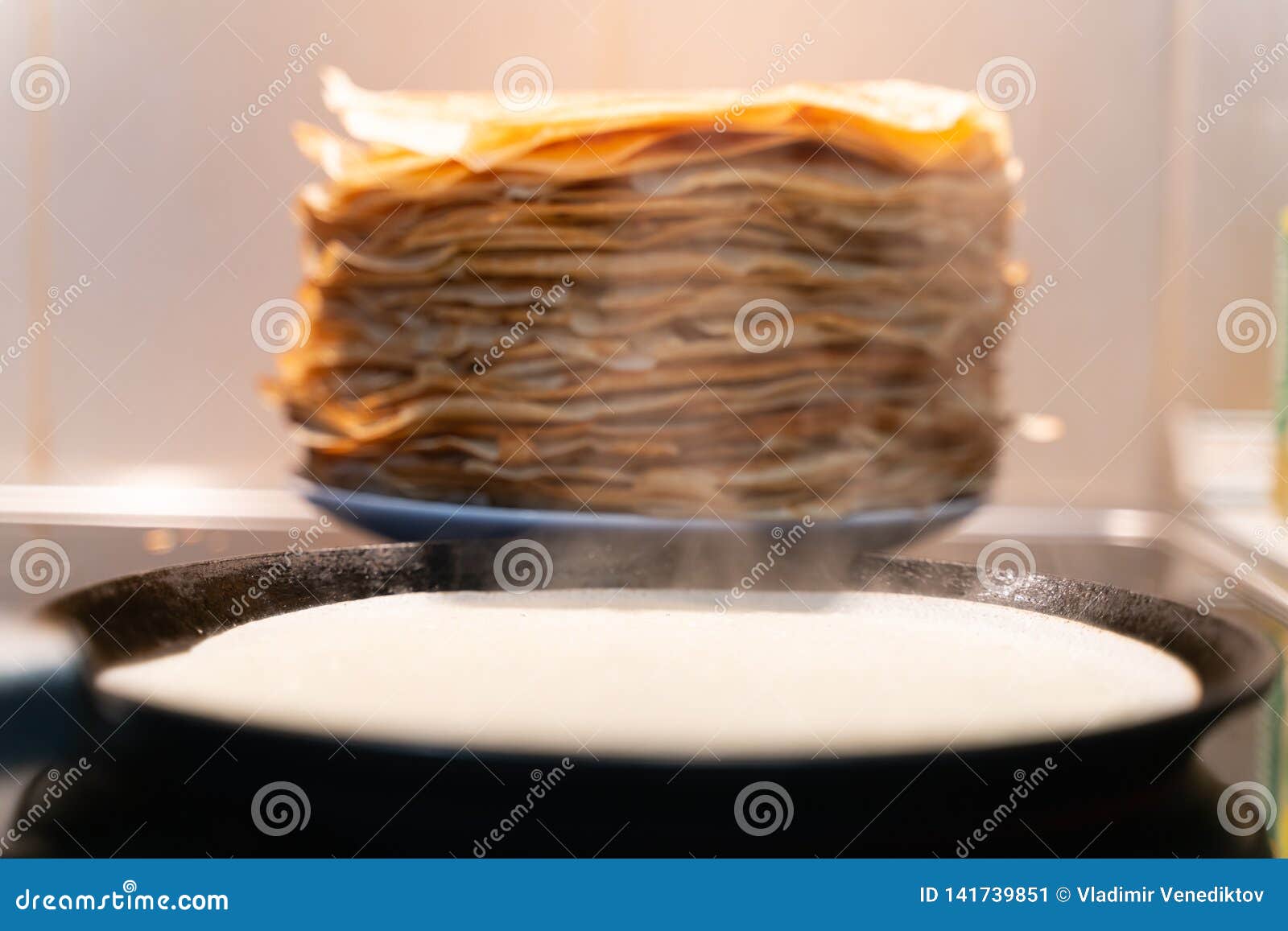 A Stack of Ready-made Fried Pancakes. Pancakes are Fried on a Black ...