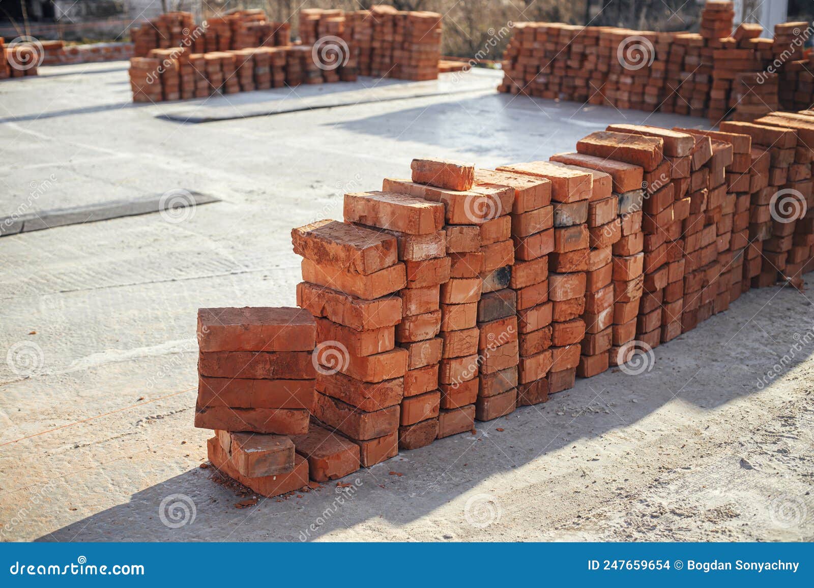 Stack of Red Bricks on Concrete Foundation, Process of House Building ...