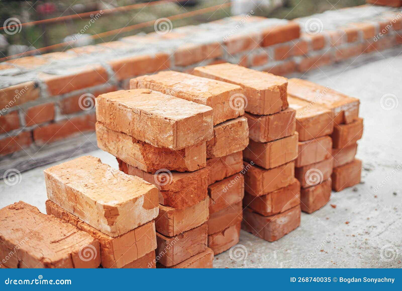 Stack of Red Bricks on Concrete Foundation, Process of House Building ...