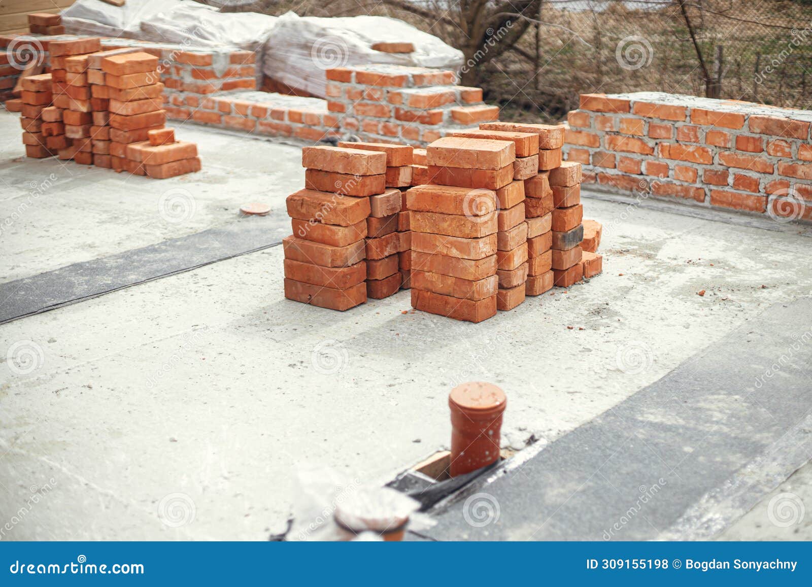 Stack of Red Bricks on Concrete Foundation, Process of House Building ...