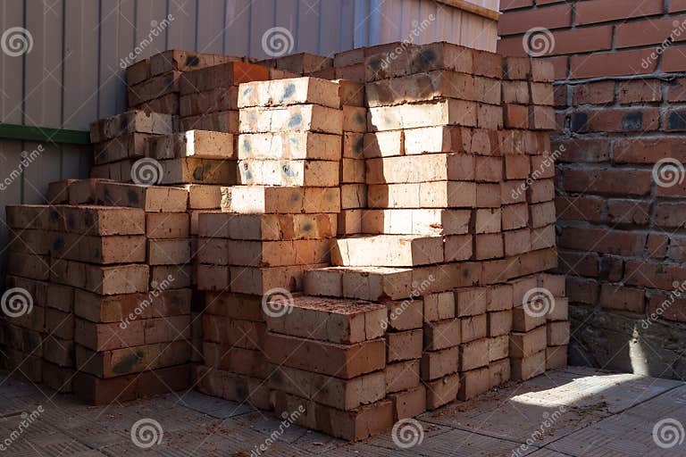 Stack of Red Bricks on Concrete Foundation, Process of House Building ...