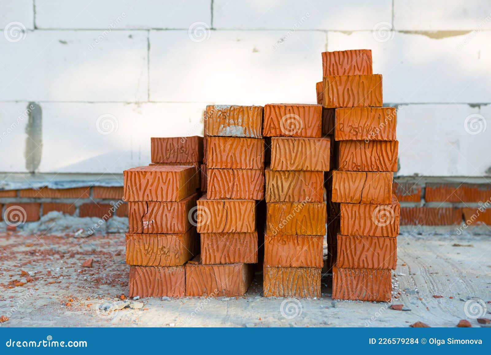 A Stack of Red Bricks at a Construction Site. Construction Materials ...