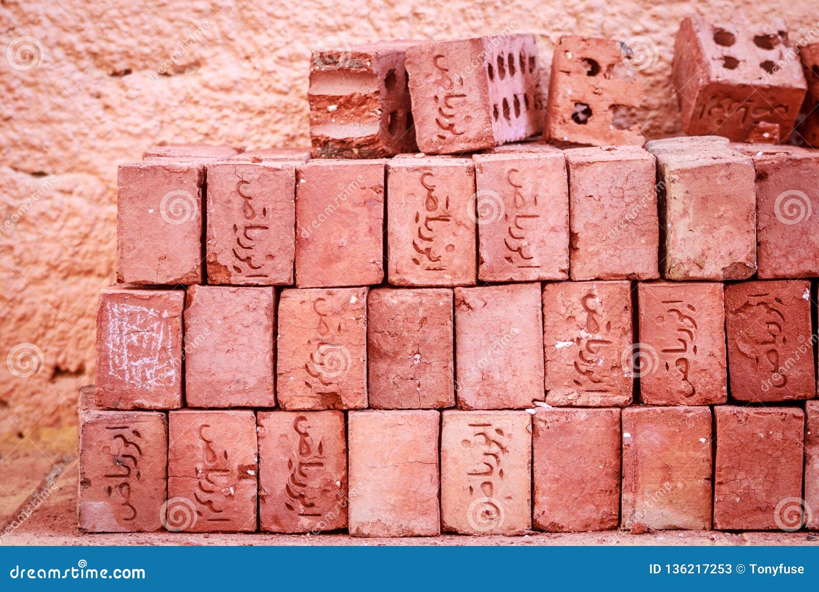 Stack of Red Bricks with Inscriptions on the Street Stock Image - Image ...