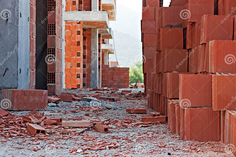 Stack of Red Building Blocks on Messy Site Stock Image - Image of ...
