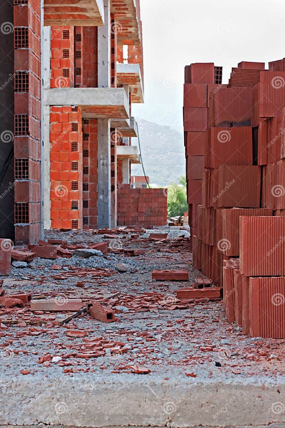 Stack of Red Building Blocks on Messy Site Stock Photo - Image of ...