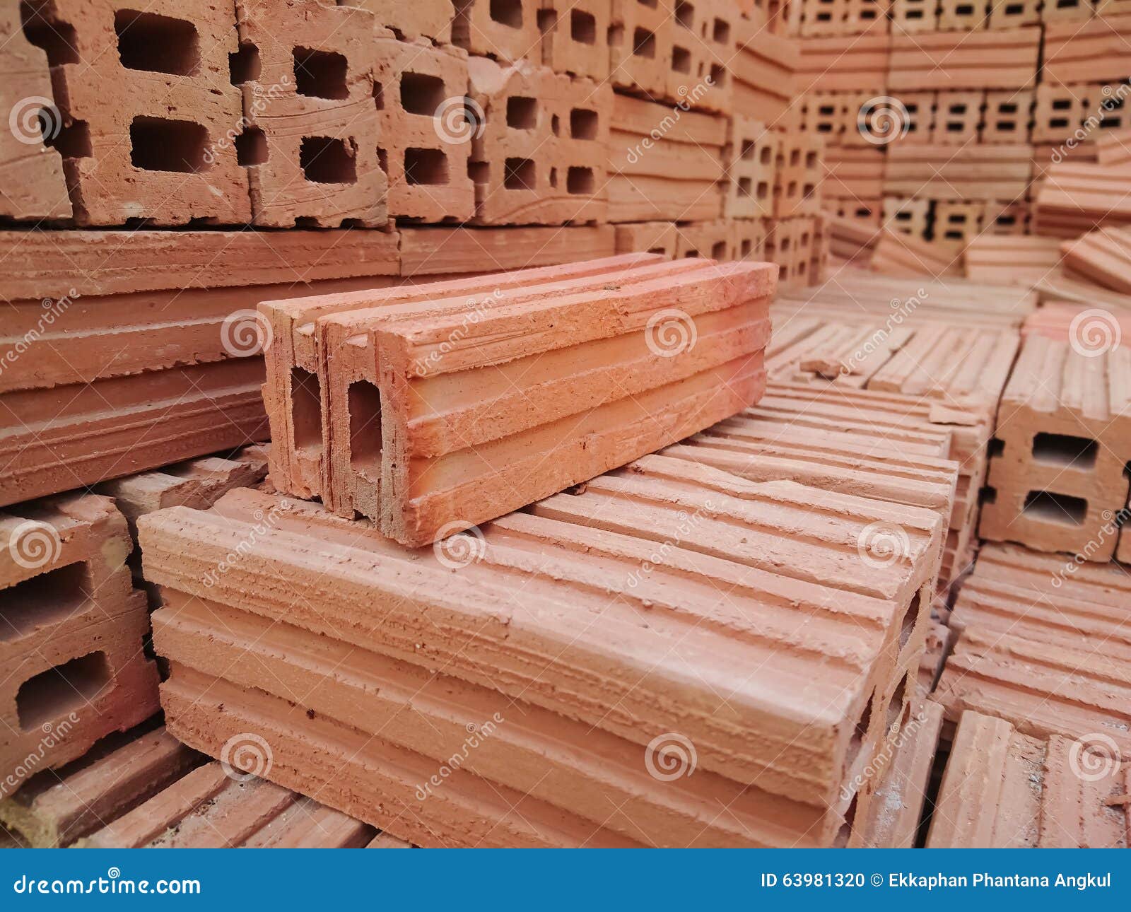 Stack of red clay bricks stock photo. Image of industrial - 63981320