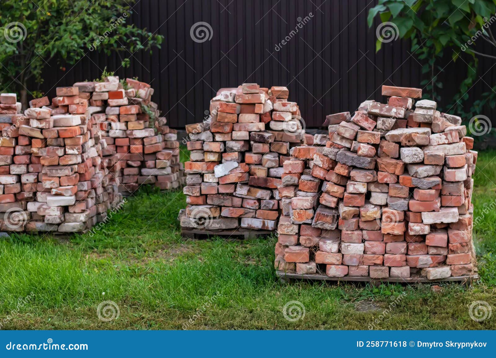 A Stack of Red Clay Bricks on a Grass Stock Photo - Image of bricks ...