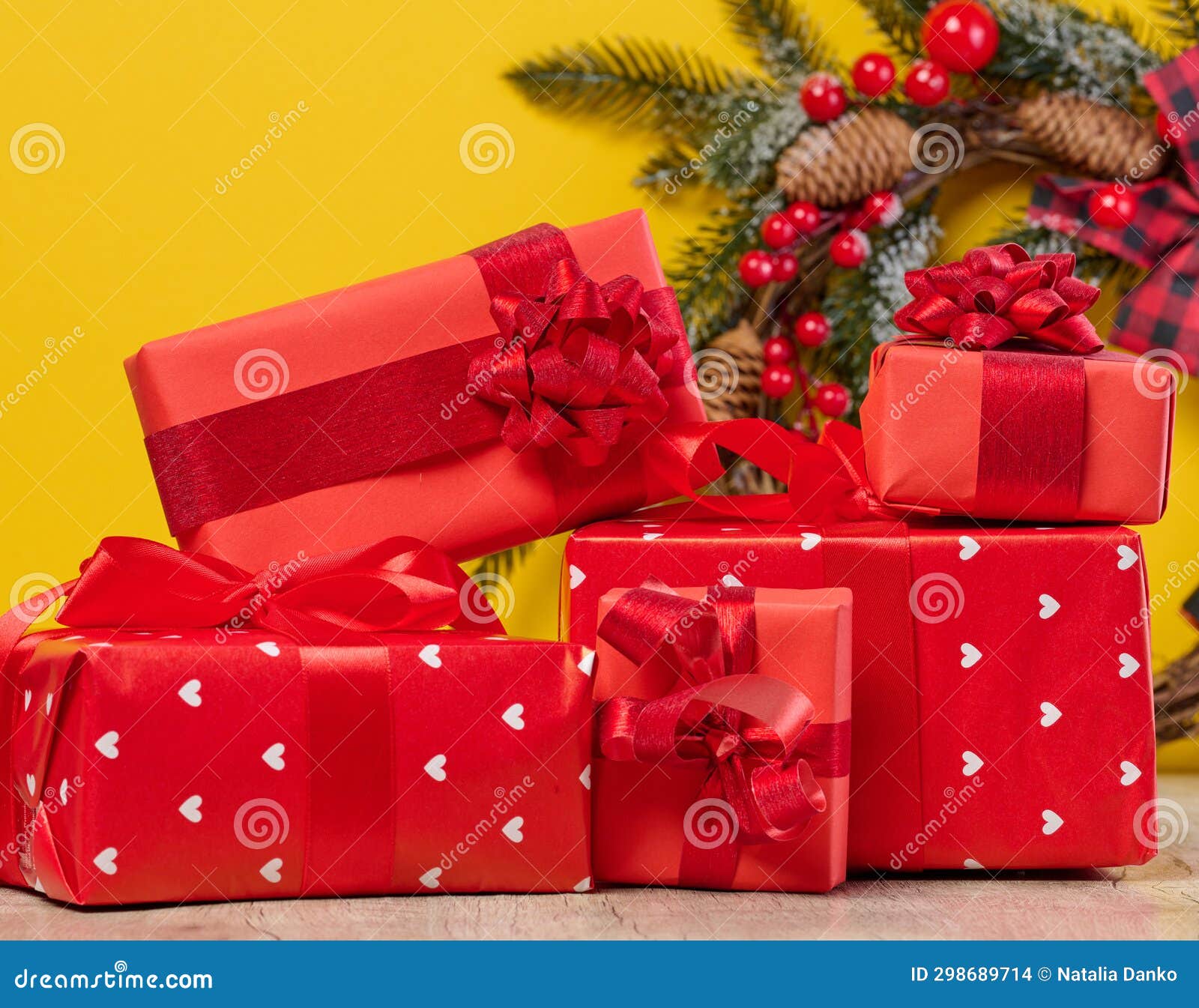 Stack of Red Gift Boxes on Yellow Background Stock Photo - Image of ...