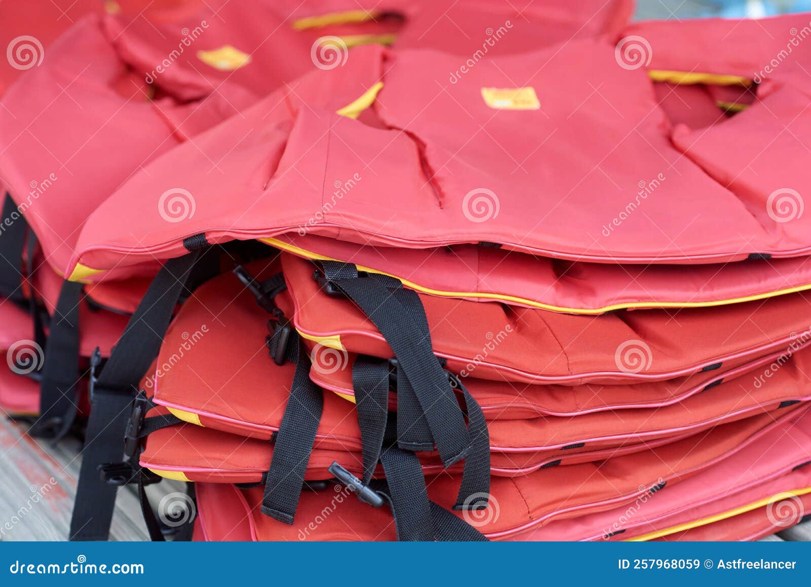 A Stack of Red Life Jackets with Black Straps Stock Image - Image of ...