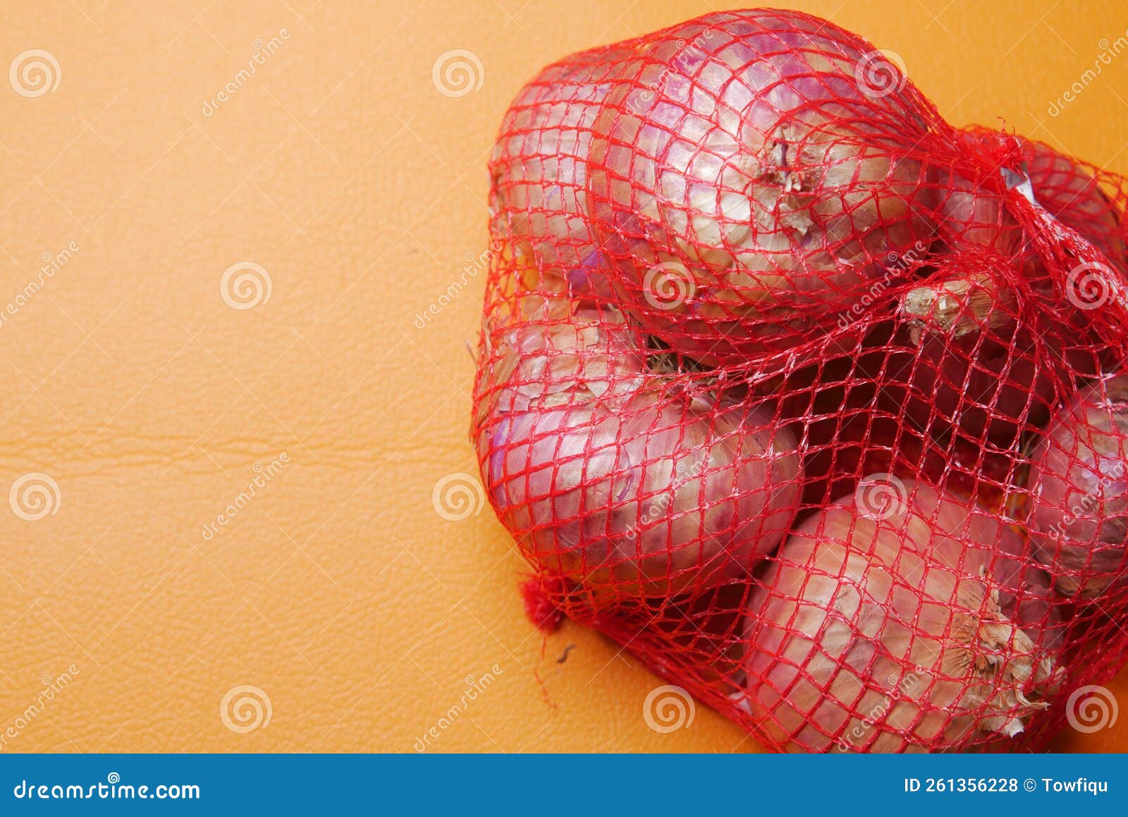 Stack of red onion in bags stock photo. Image of ripe - 261356228