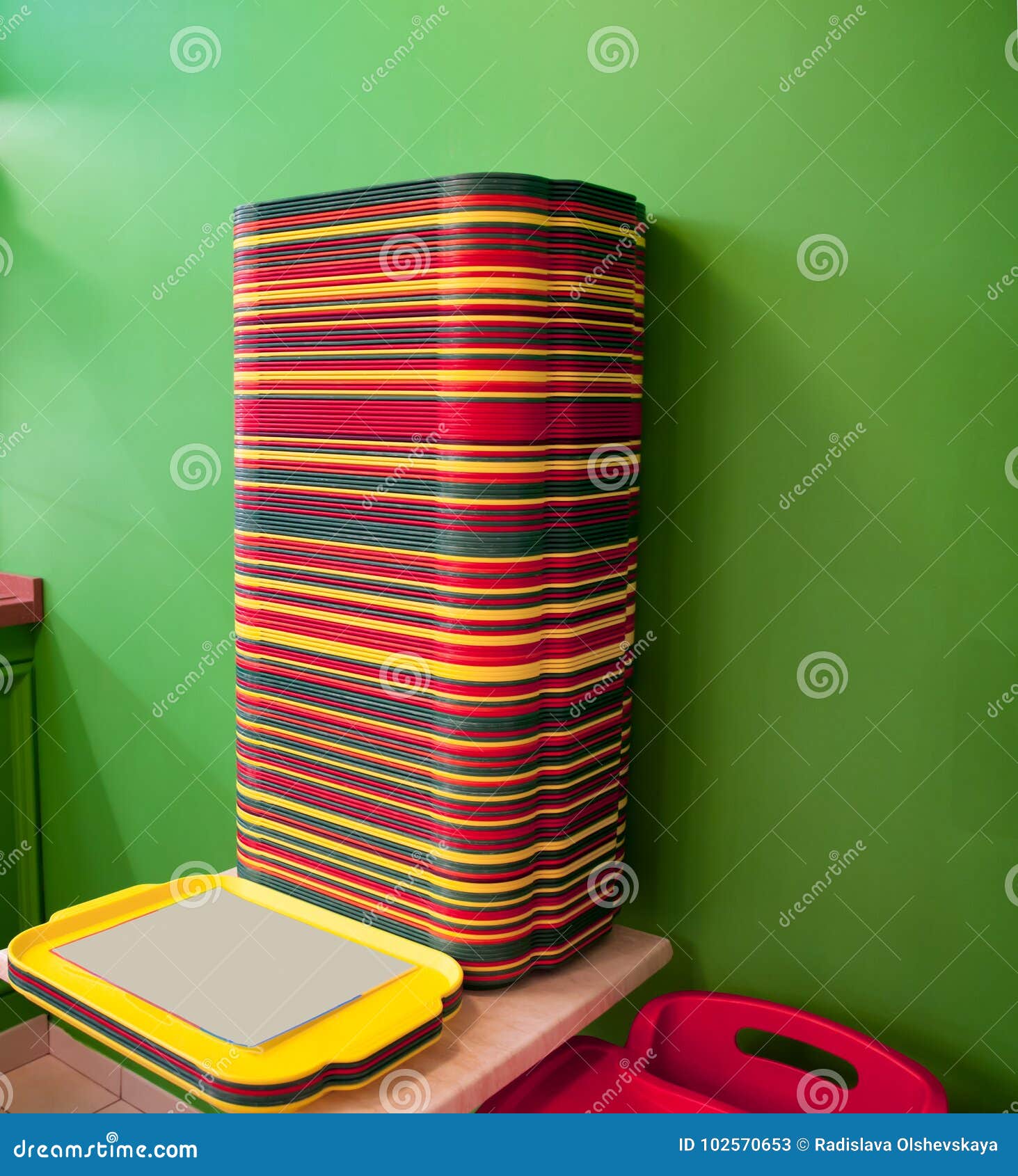 A Stack of Red, Yellow, Green Trays on the Table. Stock Image - Image ...