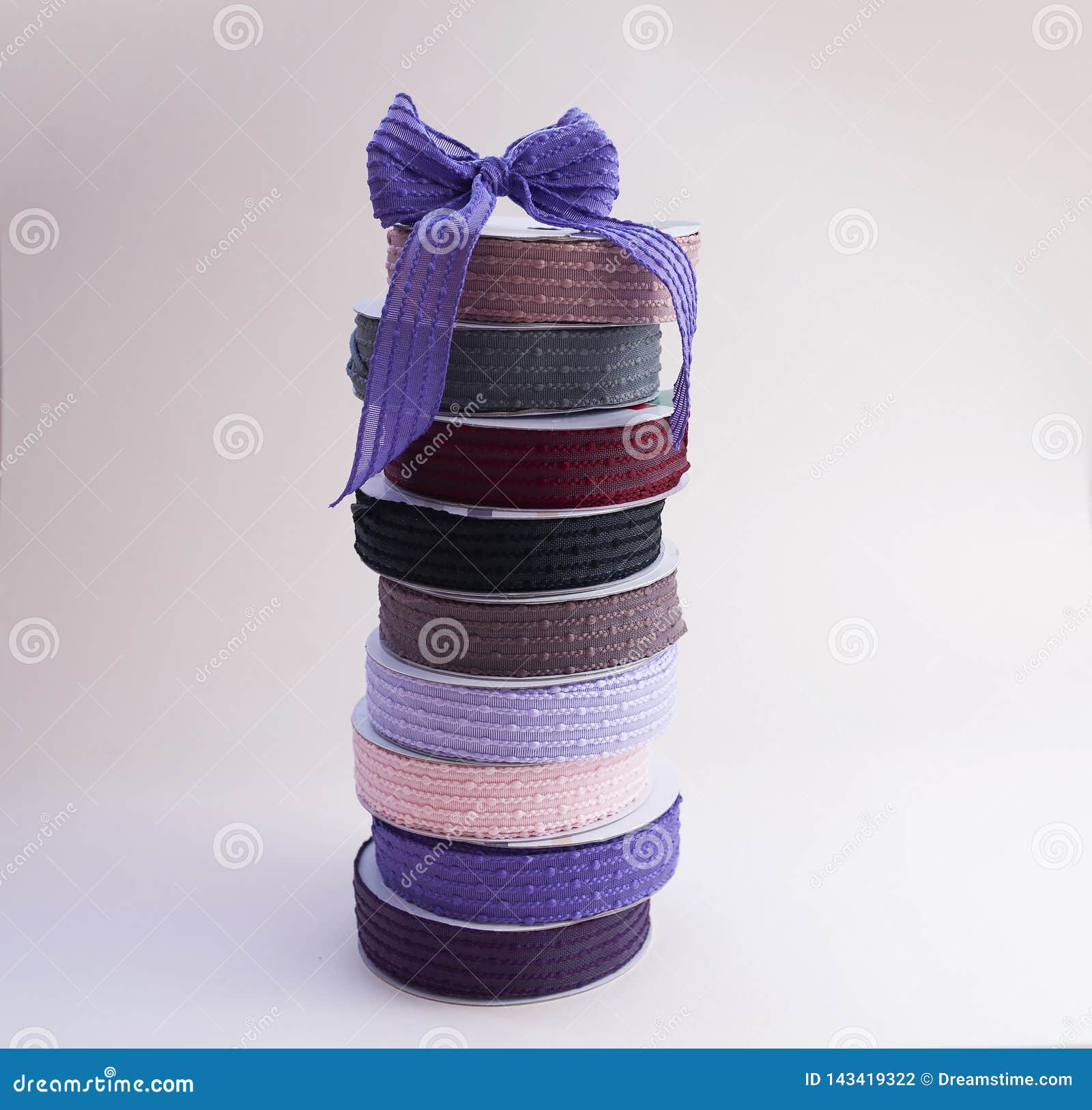 A Stack of Reels with Multi-colored Reps Ribbons for Decoration and ...