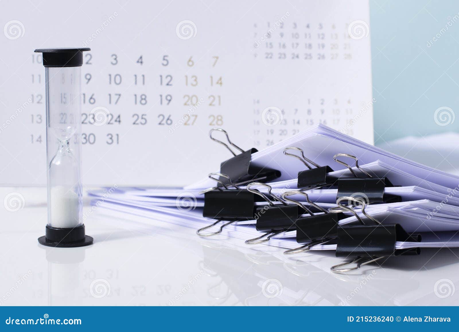 Stack of Report Paper Documents with Calendar and Hourglass. Concept of ...