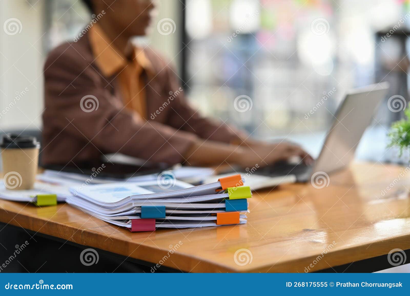 Stack of Report Paper Documents on Wooden Office Desk with Employee ...