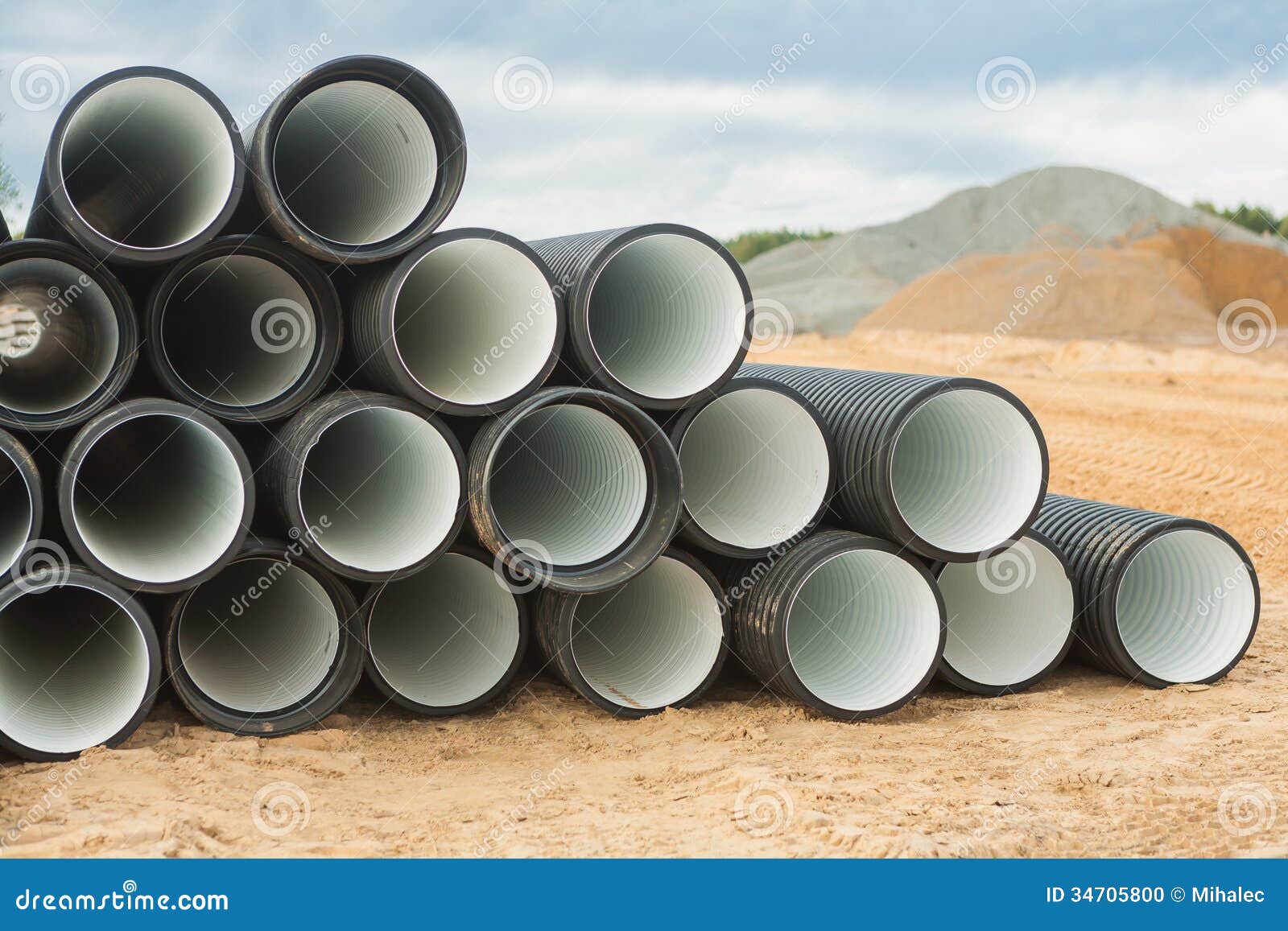 Stack of ribbed pipes stock photo. Image of hardware - 34705800