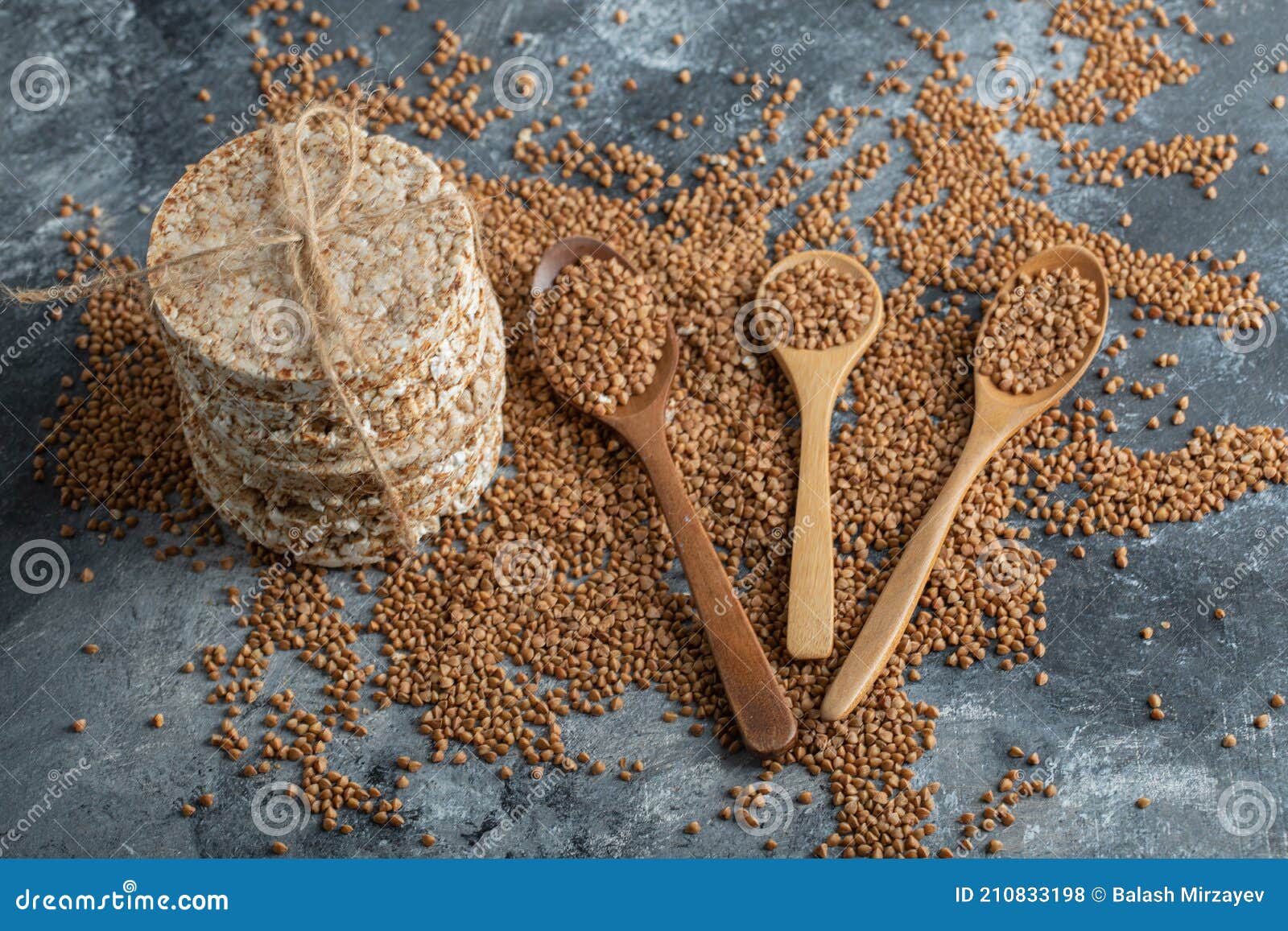 Stack of Rice Cakes and Uncooked Buckwheat on Marble Surface Stock ...