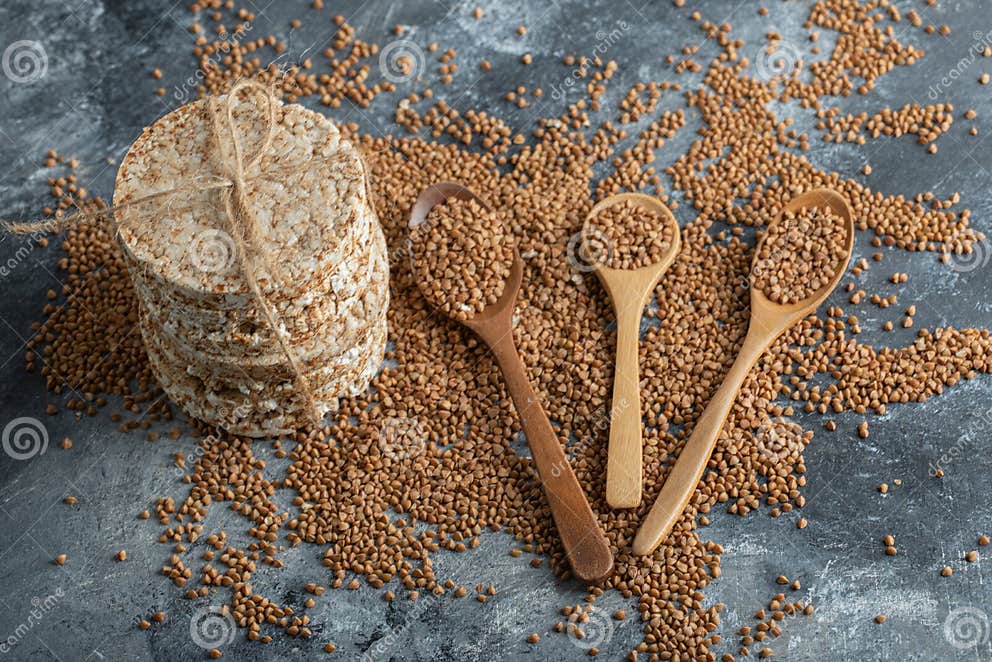 Stack of Rice Cakes and Uncooked Buckwheat on Marble Surface Stock ...