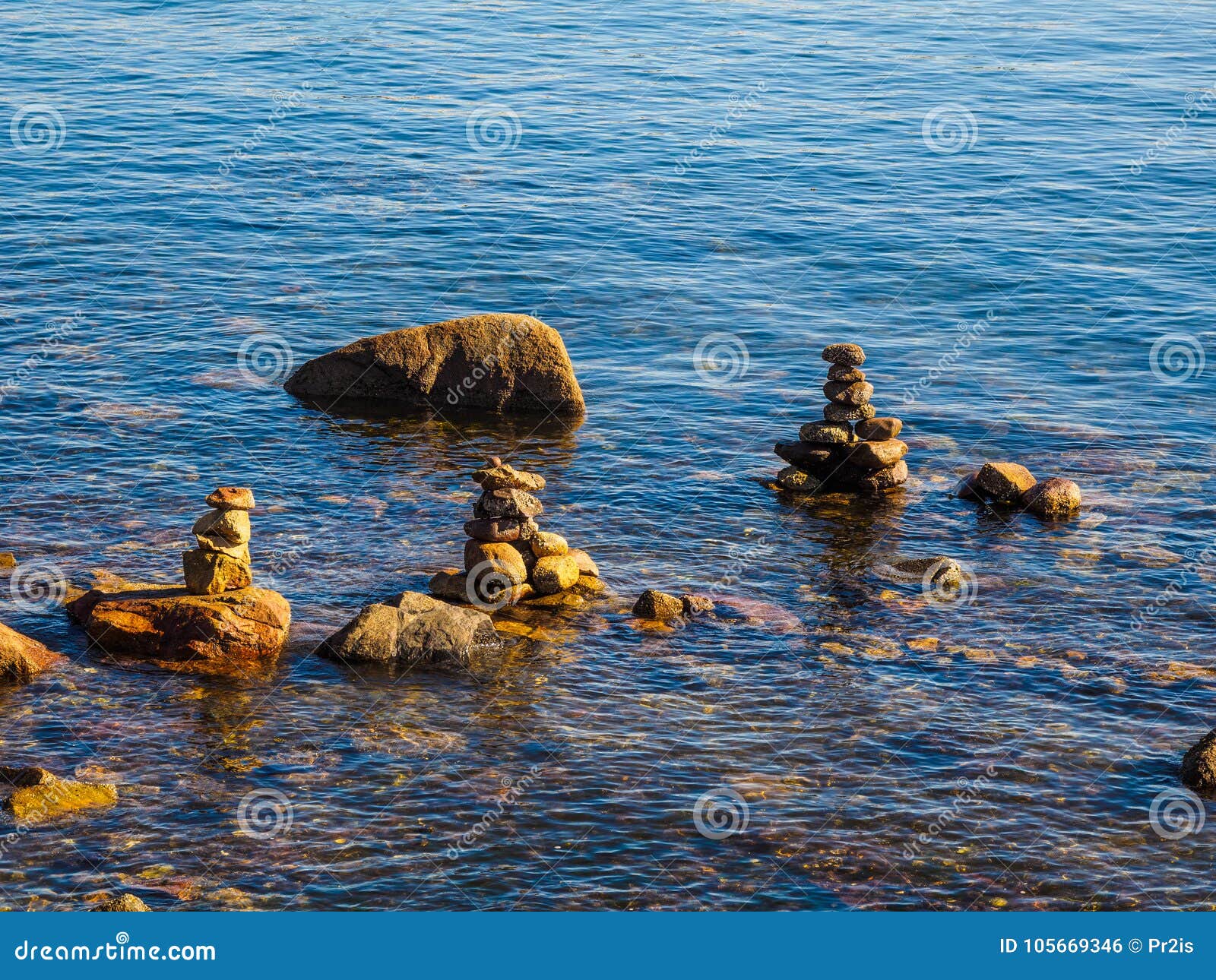 Stack of rocks in water stock photo. Image of tranquil - 105669346