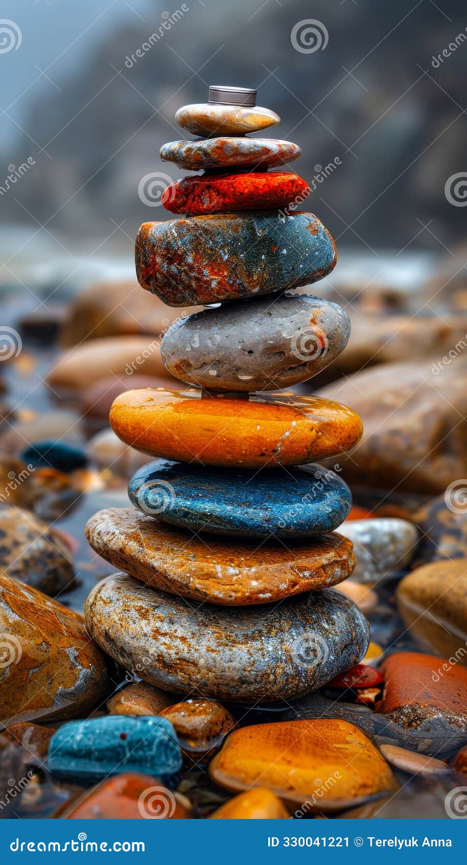 A Stack of Rocks with a Blue and Orange Rock in the Middle. the Rocks ...