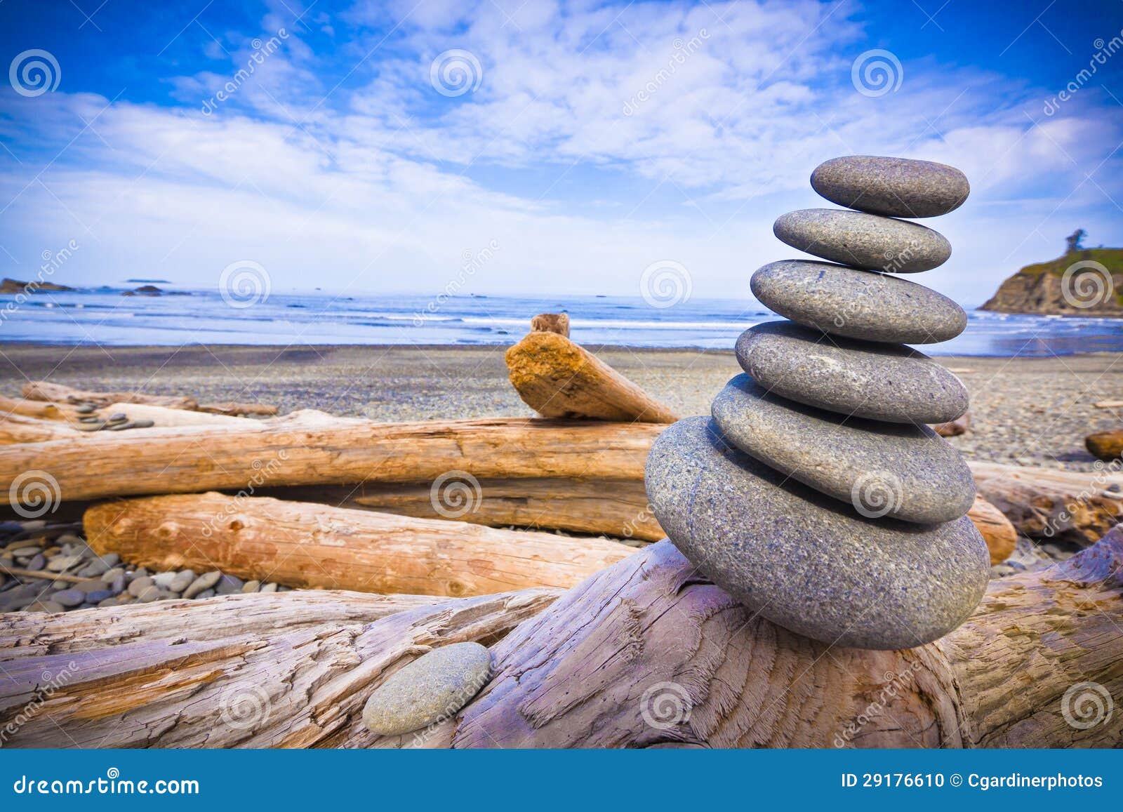 Stack of Rocks on Driftwood Stock Photo - Image of dead, shore: 29176610