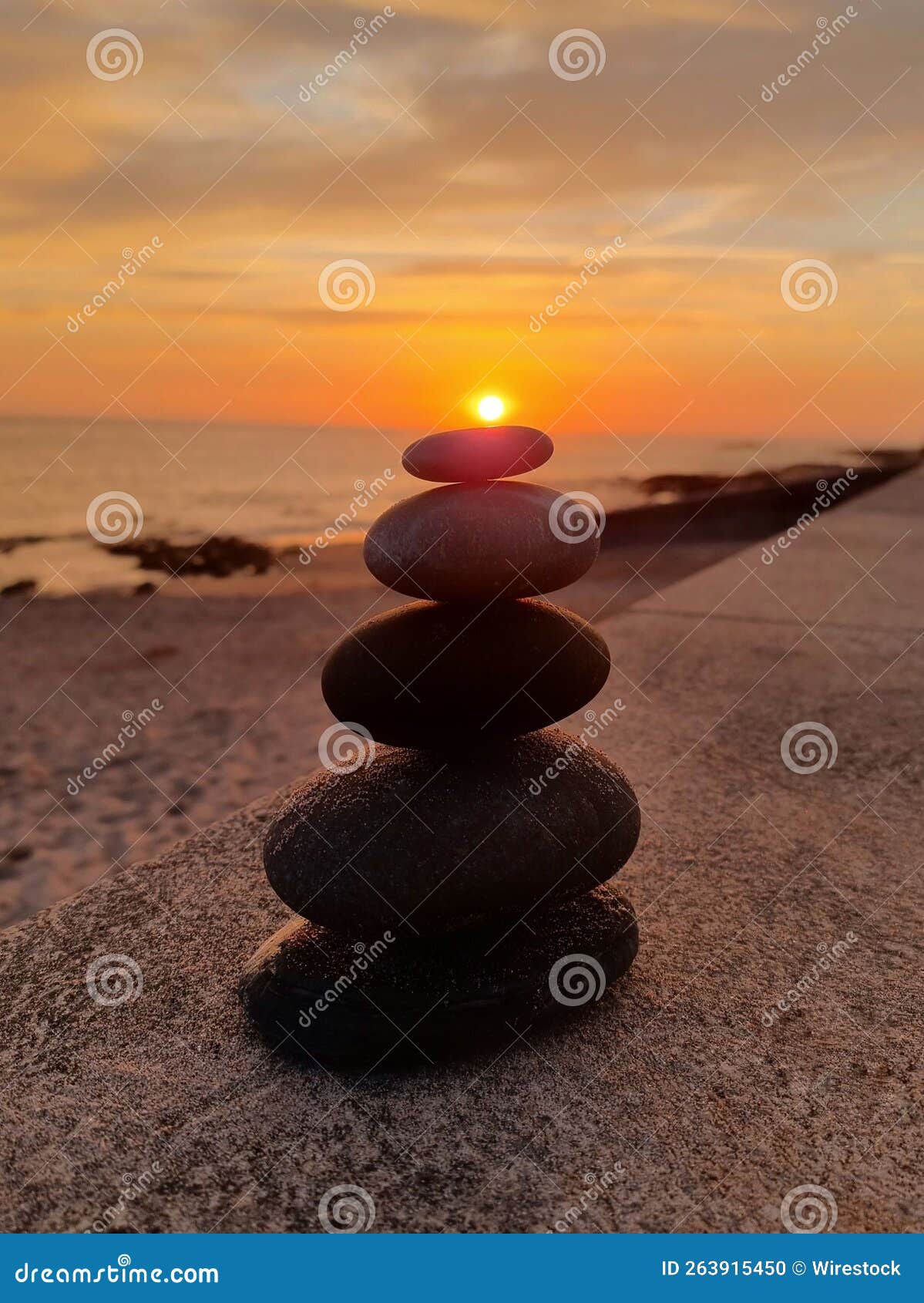 Stack of Rocks on Top of Each Other on the Beach at Sunset Stock Photo ...