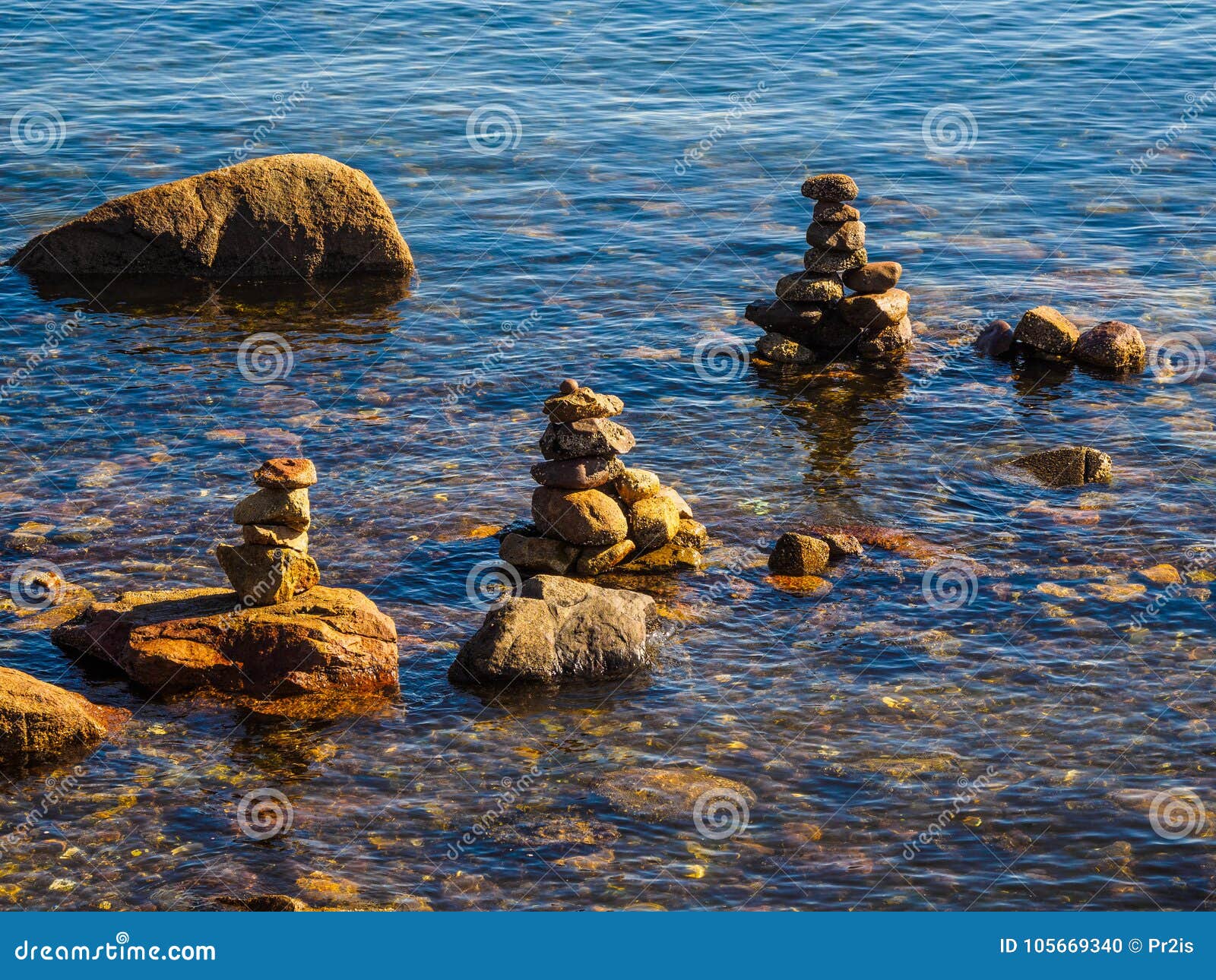 Stack of rocks in water stock photo. Image of beach - 105669340