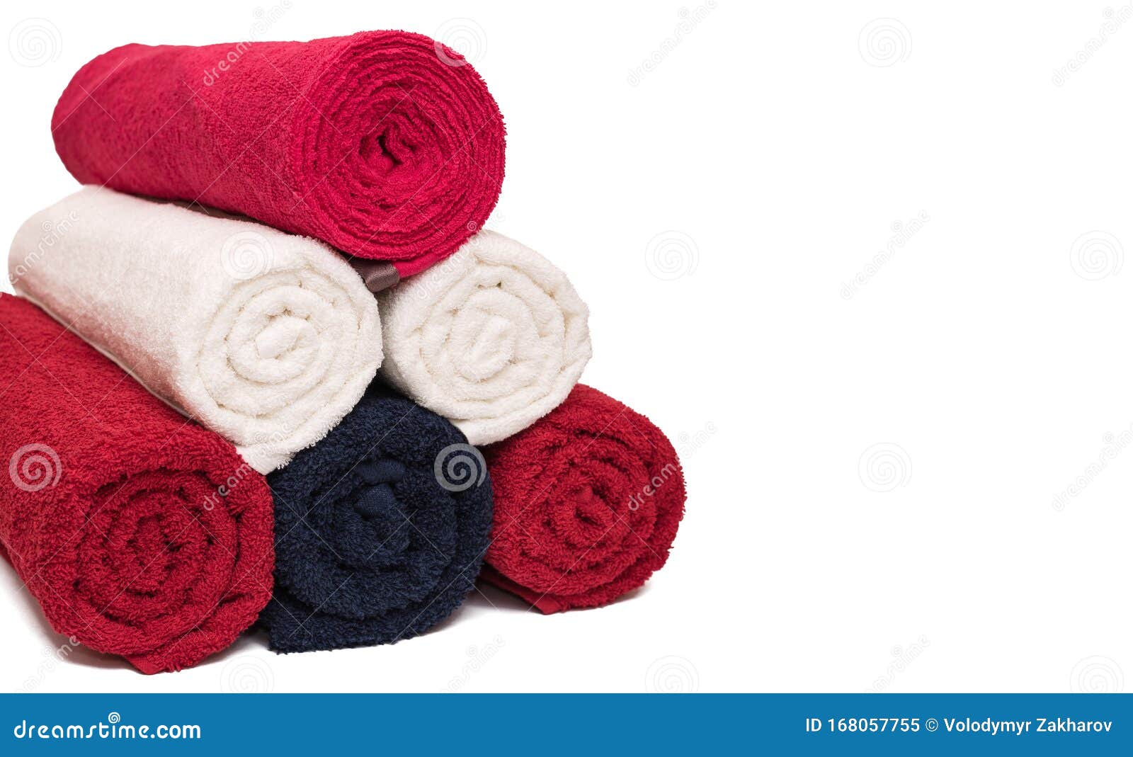 Stack of Rolled Clean Soft Bath Towels on White Background. Closeup ...
