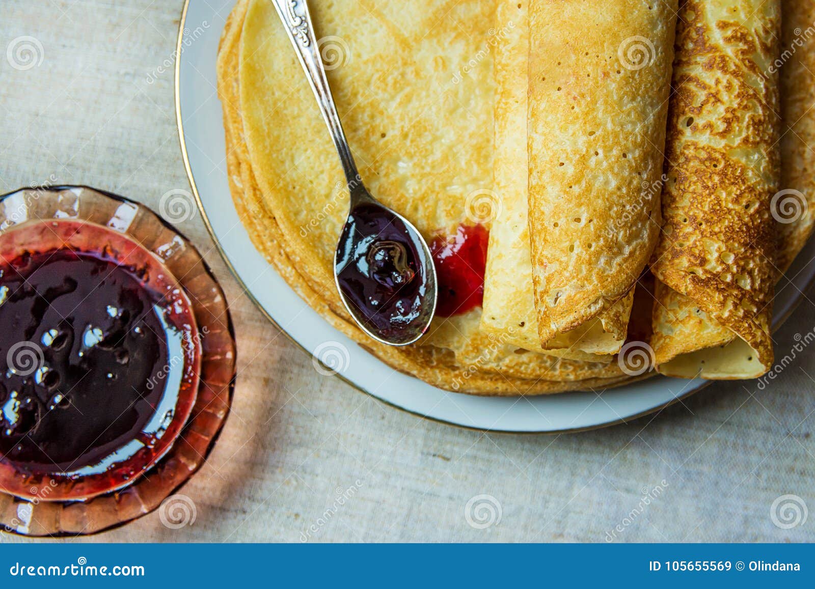 Stack of Rolled Golden Crepes on White Plate Black Currant Jam in ...