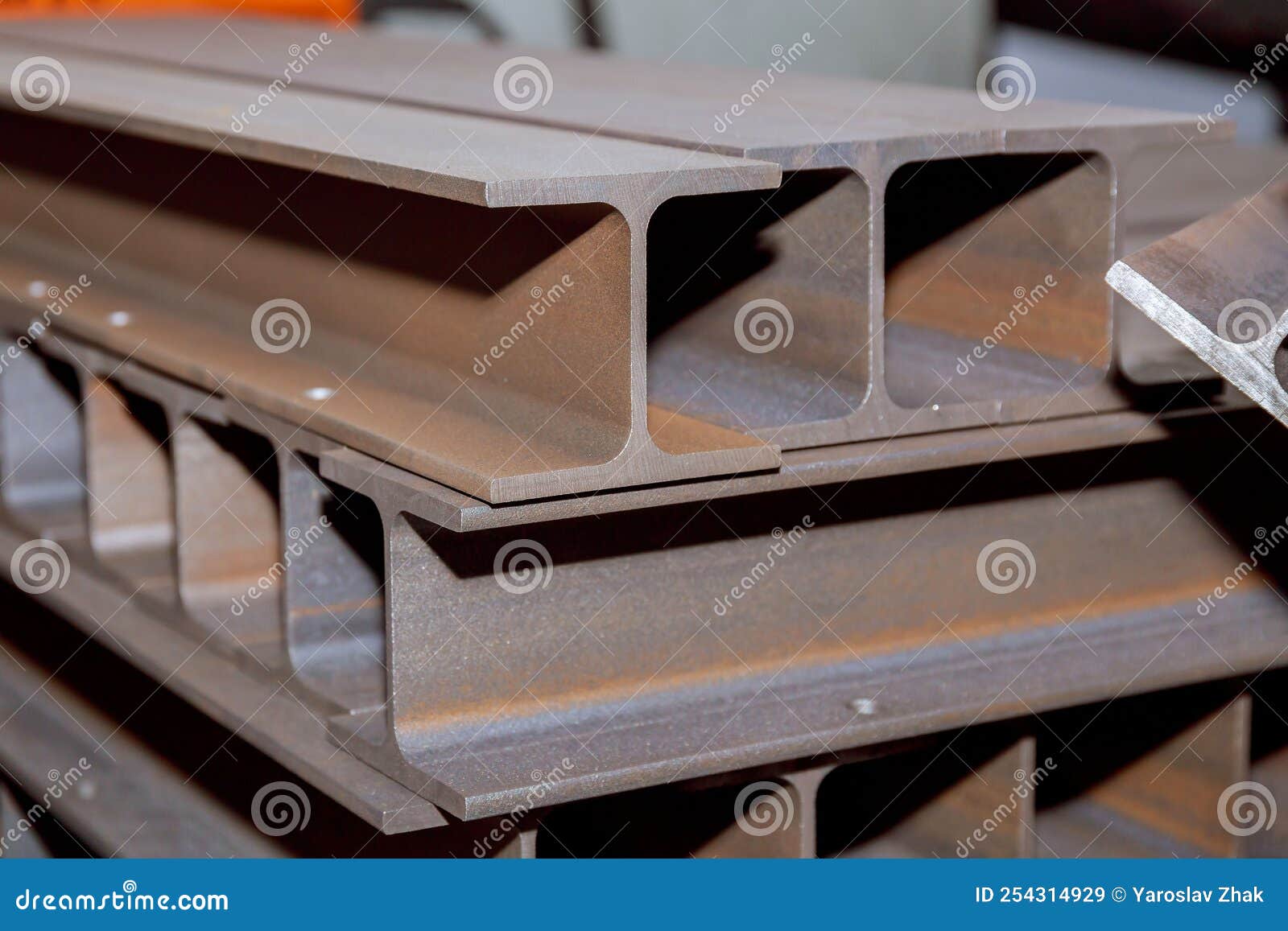 The Stack of Rolled Metal is on the Background of a Green Field, Facing ...