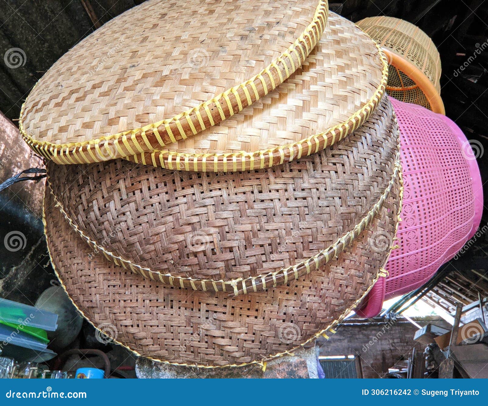 Stack of Round Woven Bamboo Trays and Basket Hanging on the Wall Stock ...