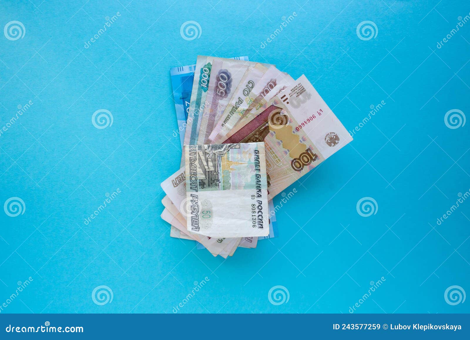 A Stack of Russian Banknotes. a Bundle of Russian Money on a Blue ...