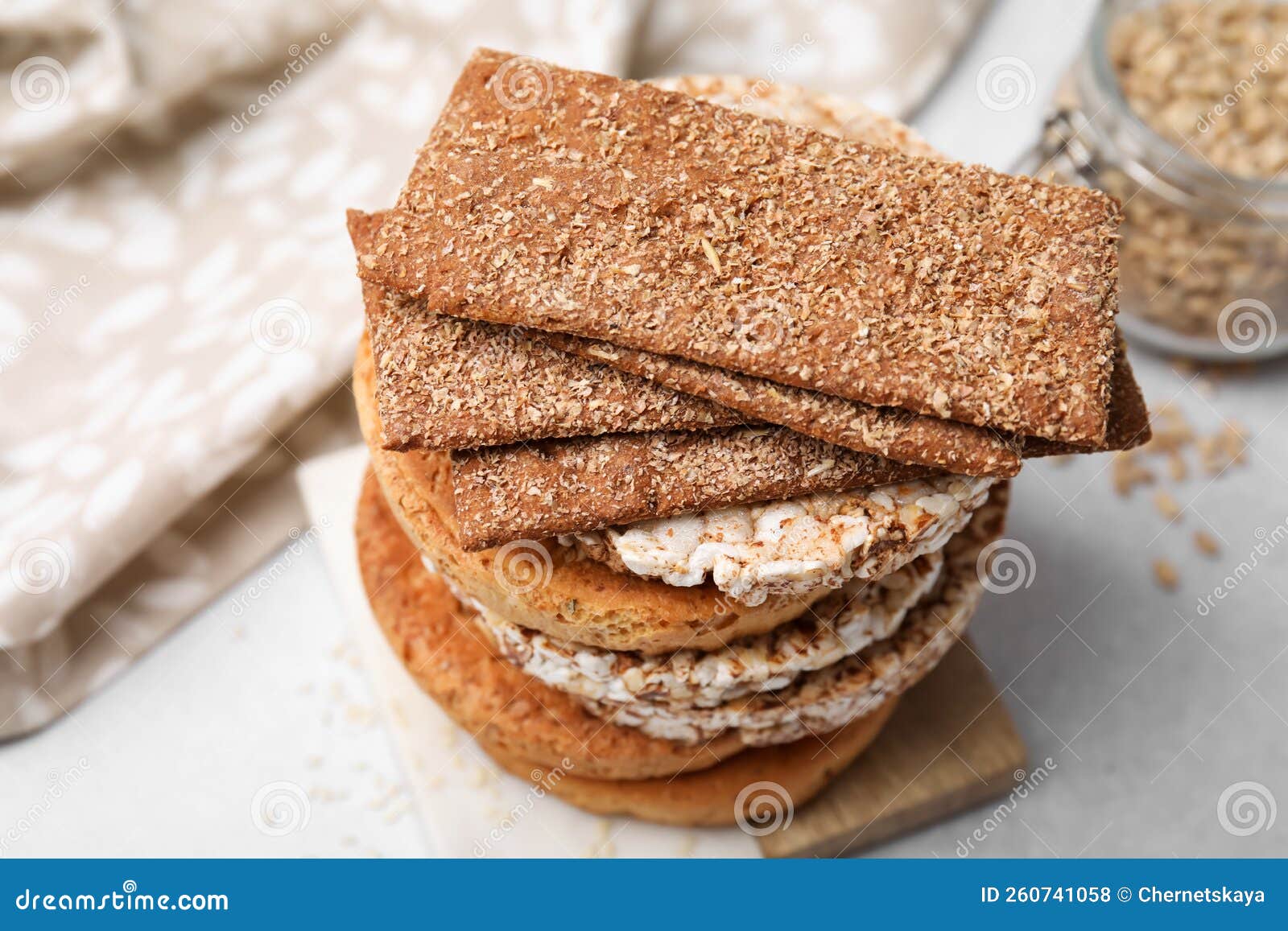 Stack of Rye Crispbreads, Rice Cakes and Rusks on White Table, Closeup ...
