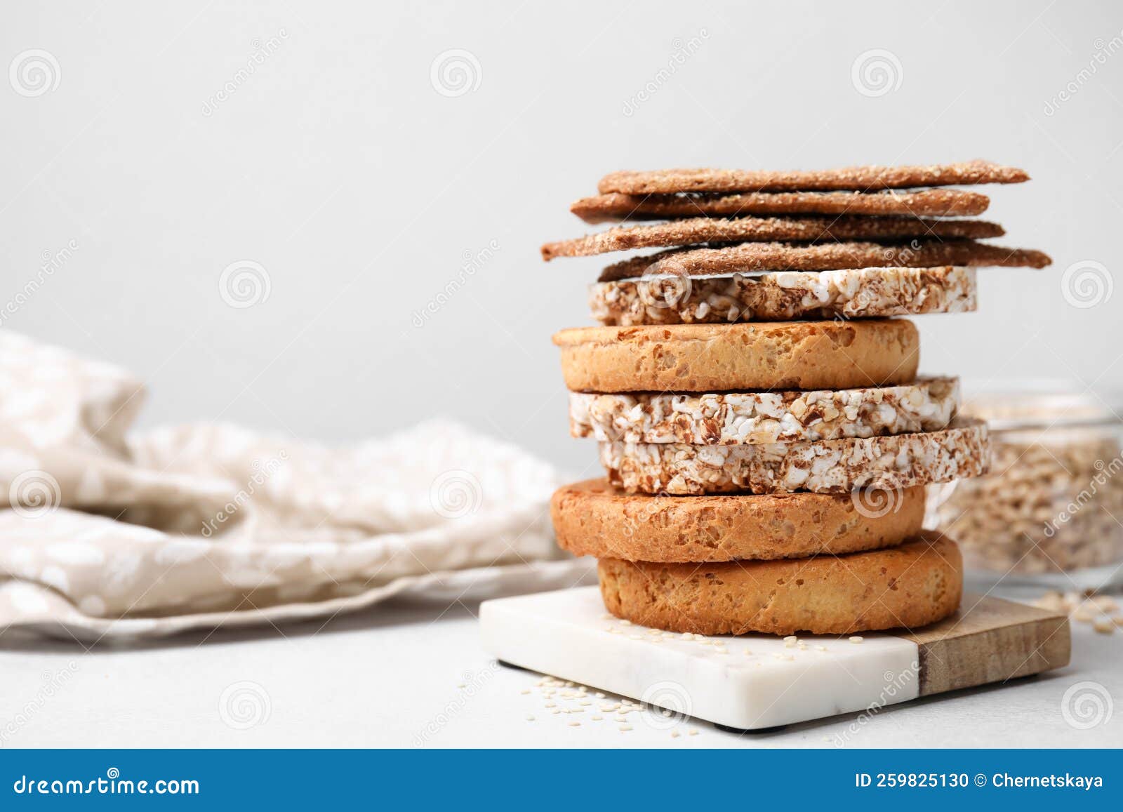 Stack of Rye Crispbreads, Rice Cakes and Rusks on White Table, Space ...