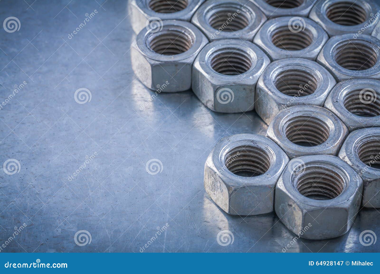 Stack of Screw-nuts on Metallic Background Stock Image - Image of ...