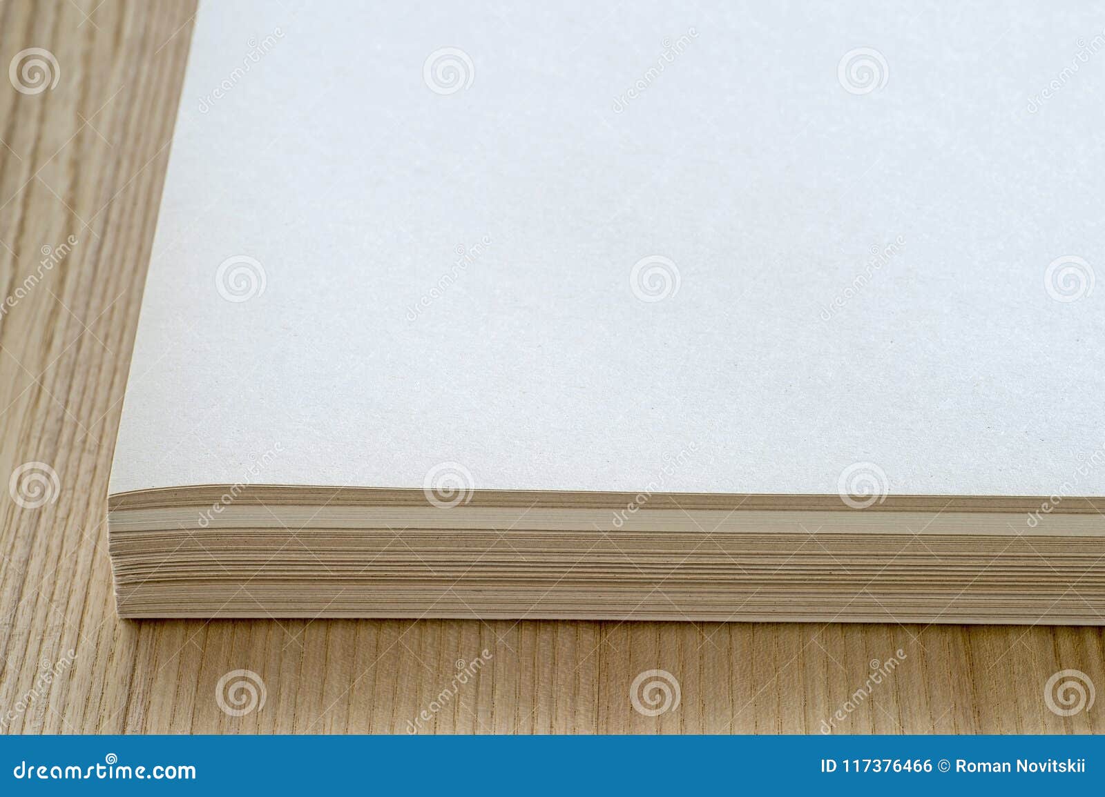 A Stack of Sheets of Clean Paper Lies on the Surface of the Table with ...