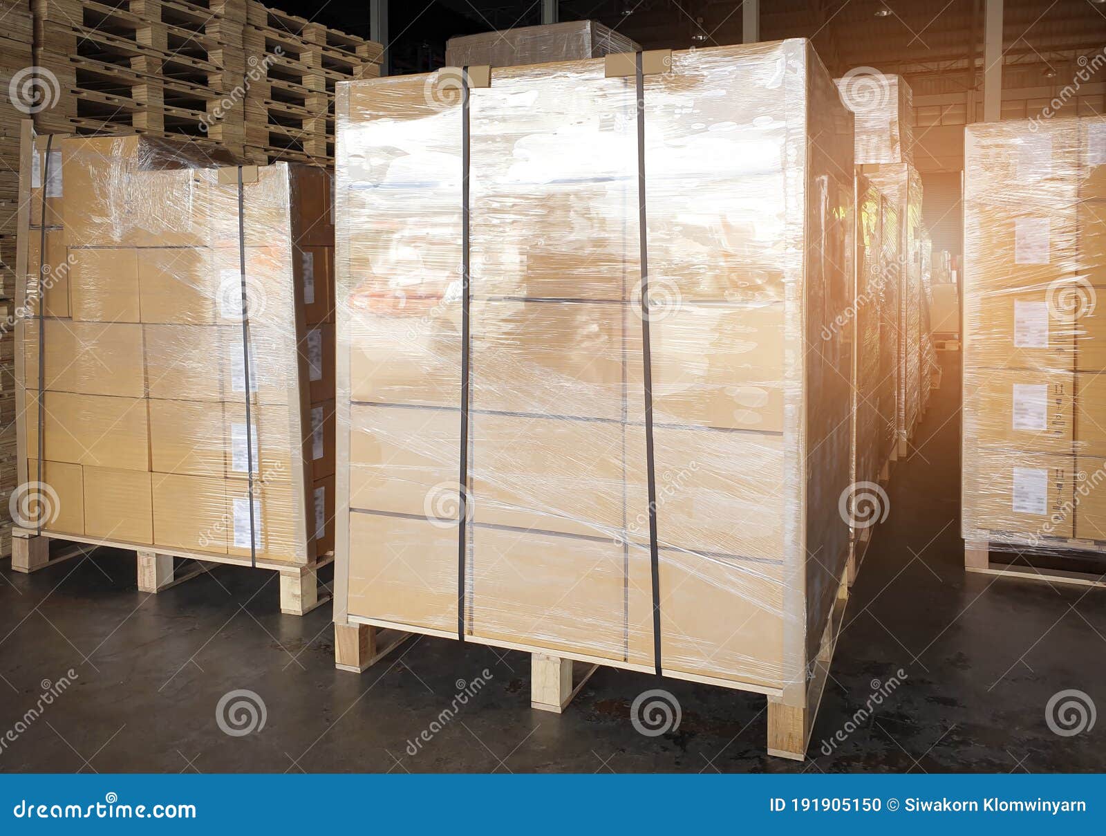 Stack of Shipment Boxes Wrapping Plastic on Wooden Pallets at Interior ...