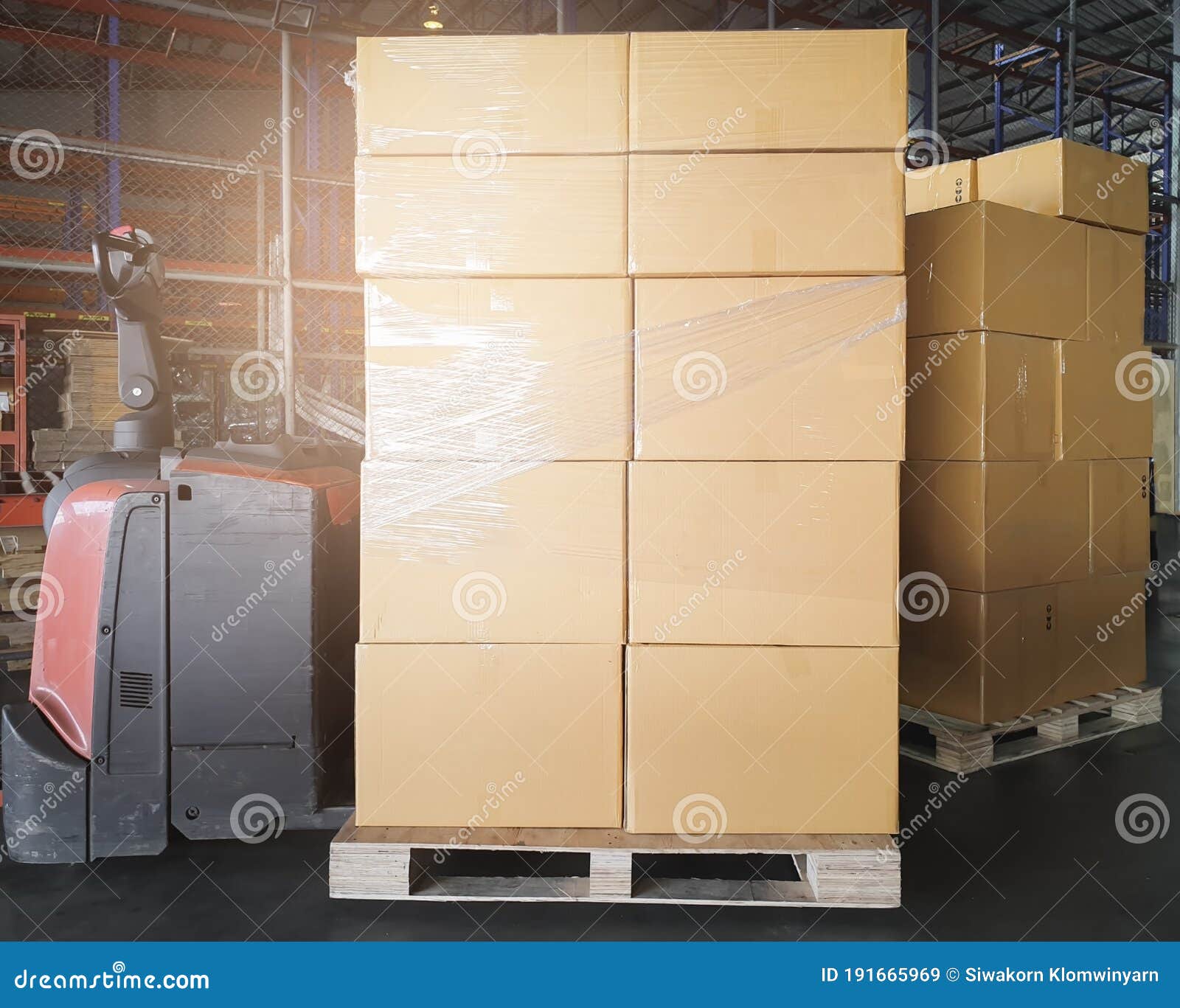 Stack Of Shipment Boxes Wrapping Plastic On Wooden Pallets At Interior ...