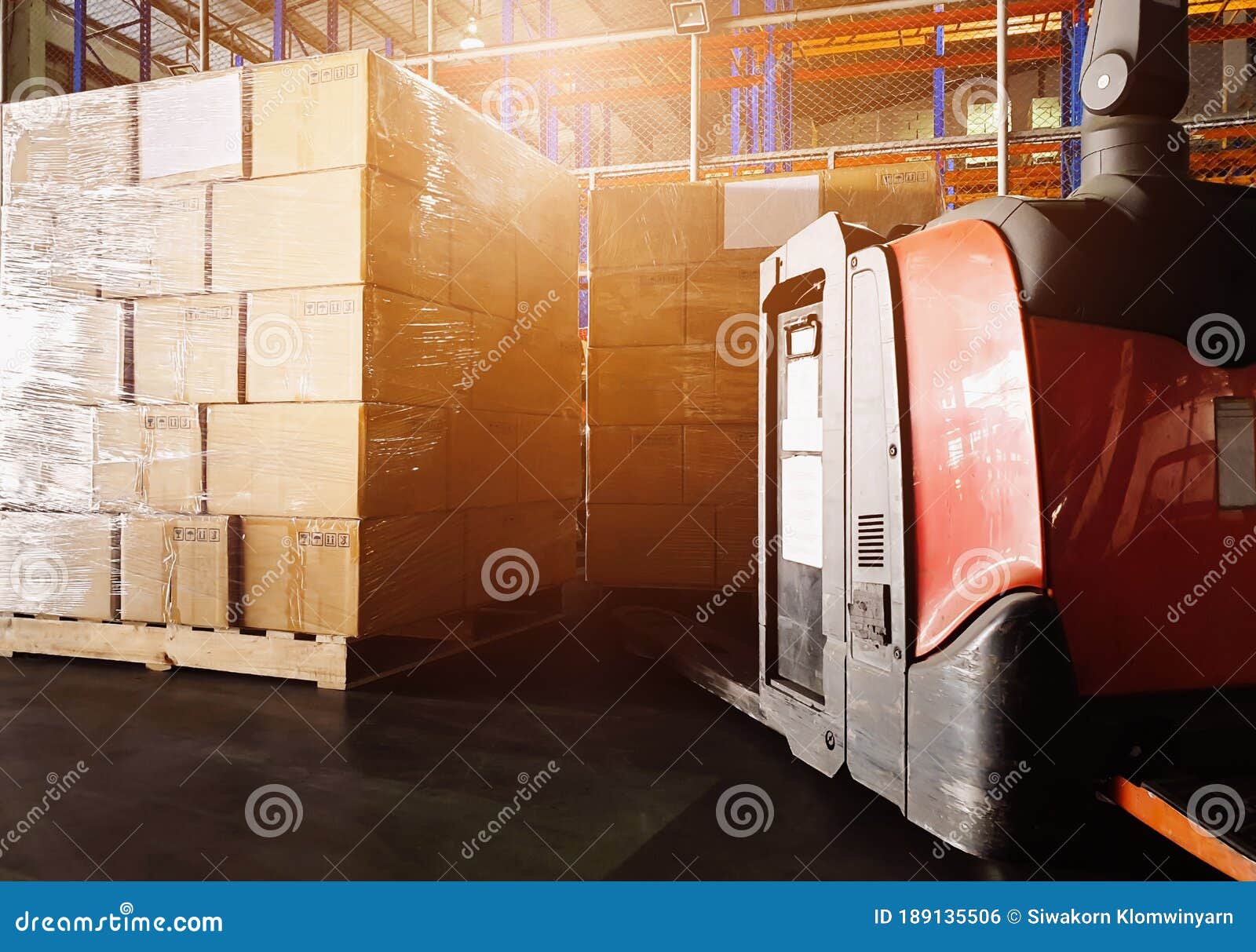 Stack of Shipments Boxes on Wooden Pallets and Electric Forklift Pallet ...