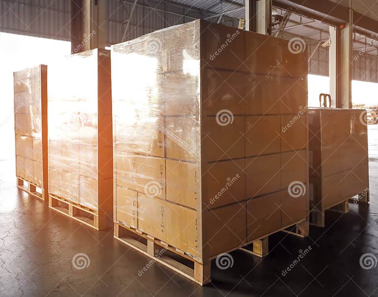 Stack of Shipments Boxes on Wooden Pallets. Interior of Warehouse ...